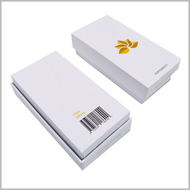 Small white cardboard boxes with lids for essential oil packaging